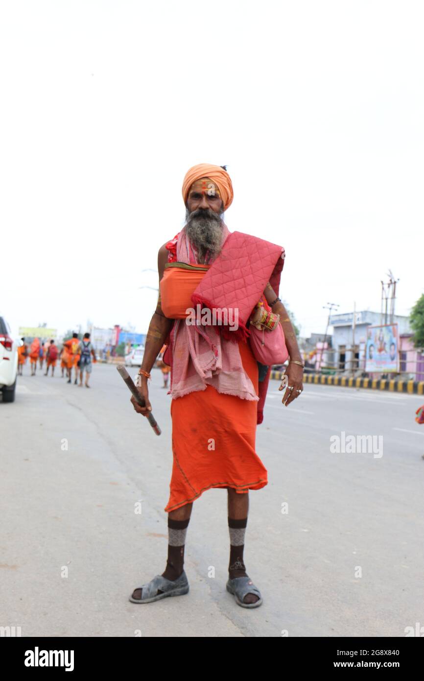 GHAZIABAD, INDIA - JULY 2019: A hindu devotee carrying kanwar on their ...