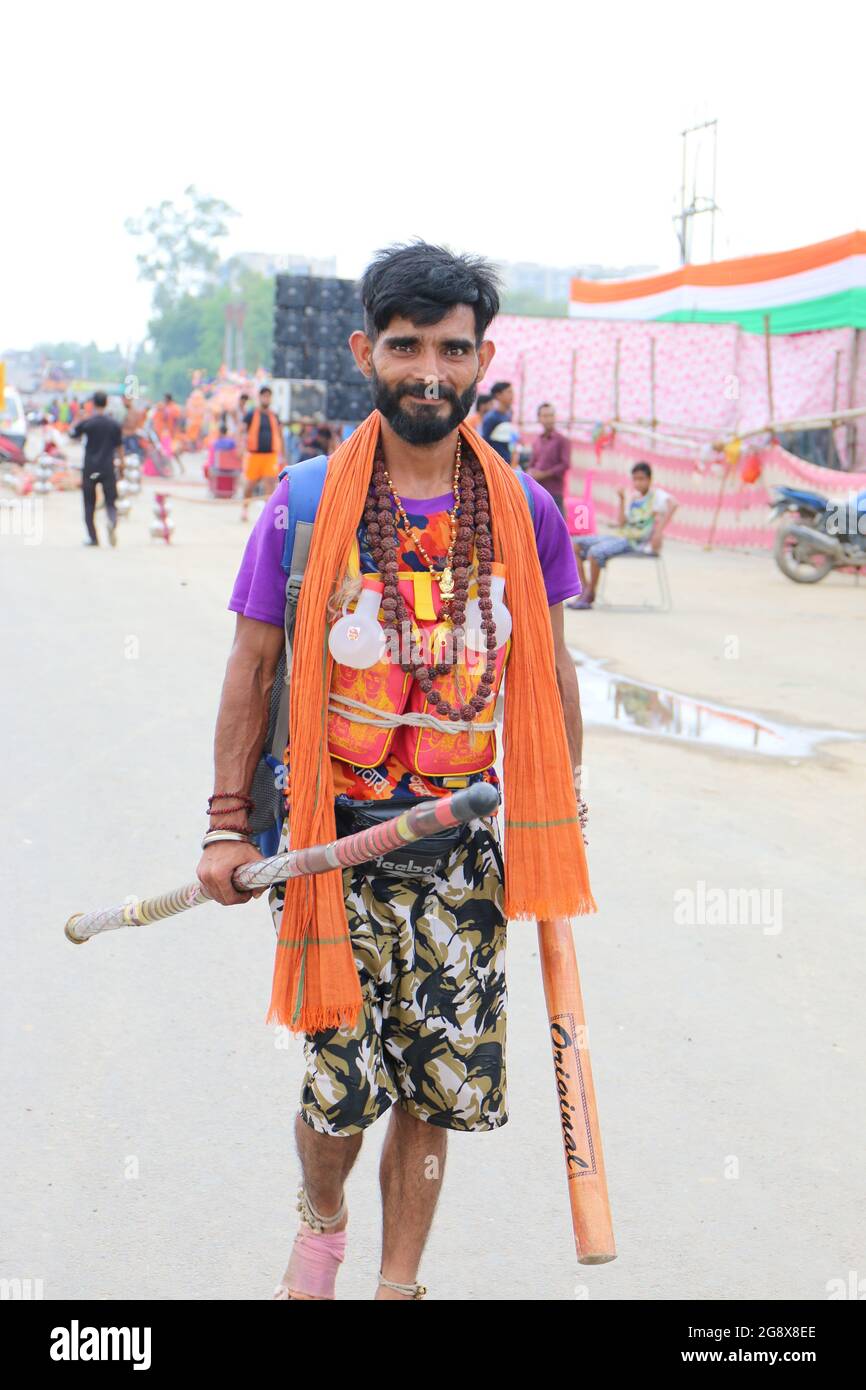 GHAZIABAD, INDIA - JULY 2019: A hindu devotee carrying kanwar on their ...