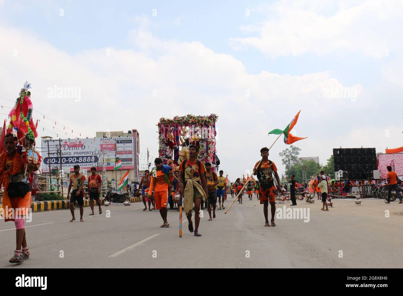 GHAZIABAD, INDIA - JULY 2019: A hindu devotee carrying kanwar on their ...