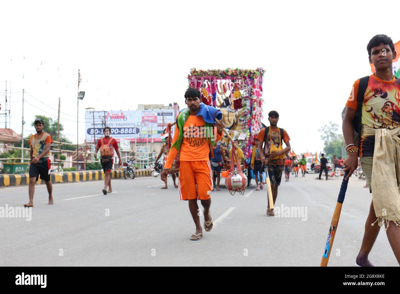 GHAZIABAD, INDIA - JULY 2019: A hindu devotee carrying kanwar on their ...