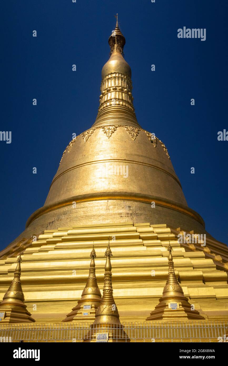 A golden stupa at Shwedagon Pagoda Buddhist religious site in Yangon ...