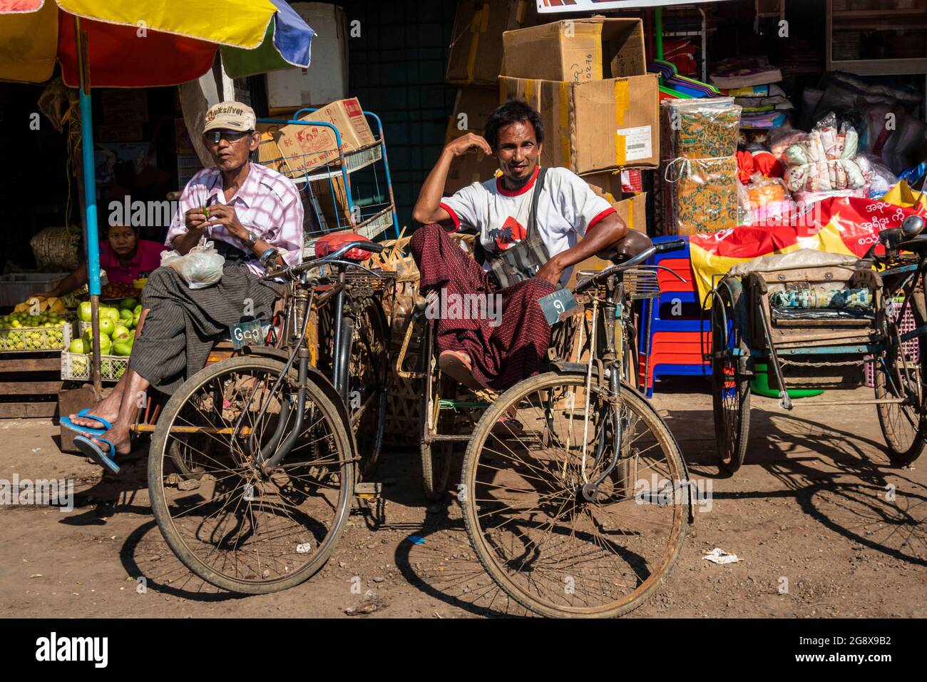 Rickshaw drivers relaxing in Yangon, Myanmar Stock Photo - Alamy