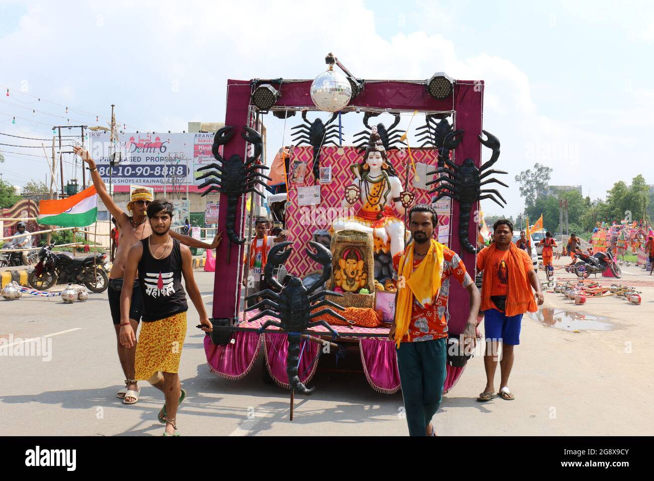GHAZIABAD, INDIA - JULY 2019: A hindu devotee carrying kanwar on their ...