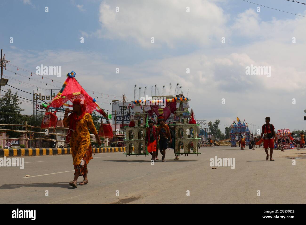 GHAZIABAD, INDIA - JULY 2019: A hindu devotee carrying kanwar on their ...