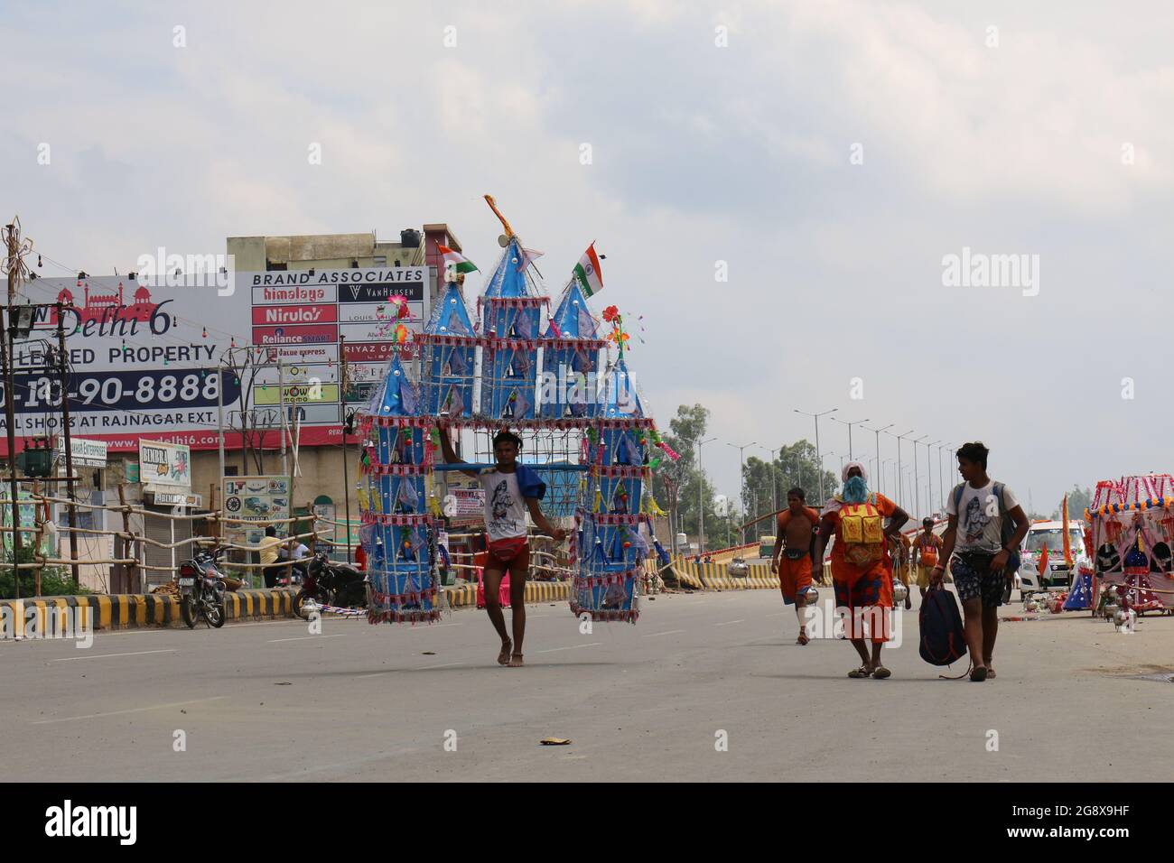 GHAZIABAD, INDIA - JULY 2019: A hindu devotee carrying kanwar on their ...
