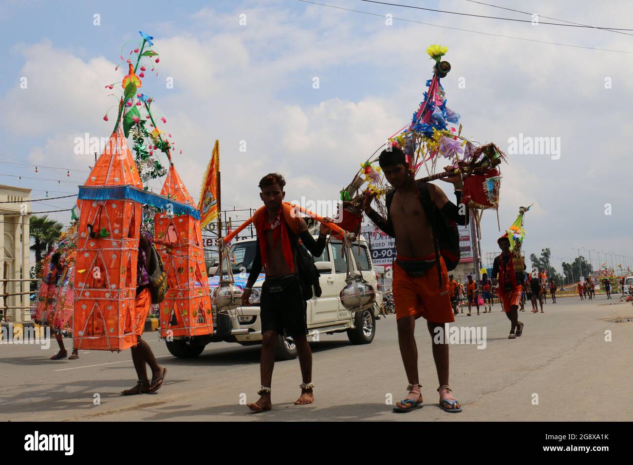 GHAZIABAD, INDIA - JULY 2019: A hindu devotee carrying kanwar on their ...