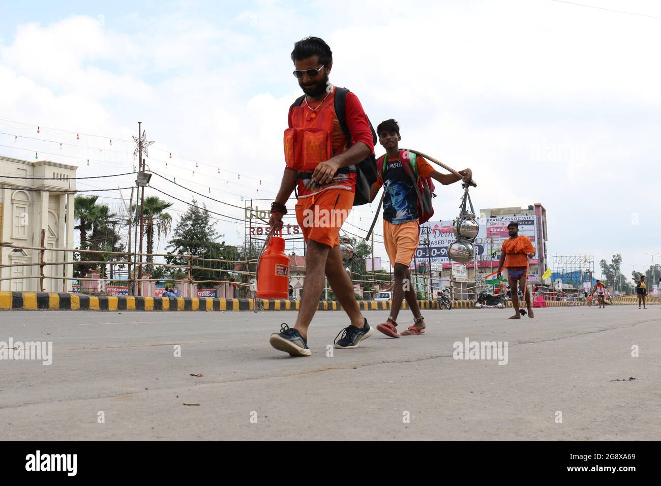 GHAZIABAD, INDIA - JULY 2019: A hindu devotee carrying kanwar on their ...