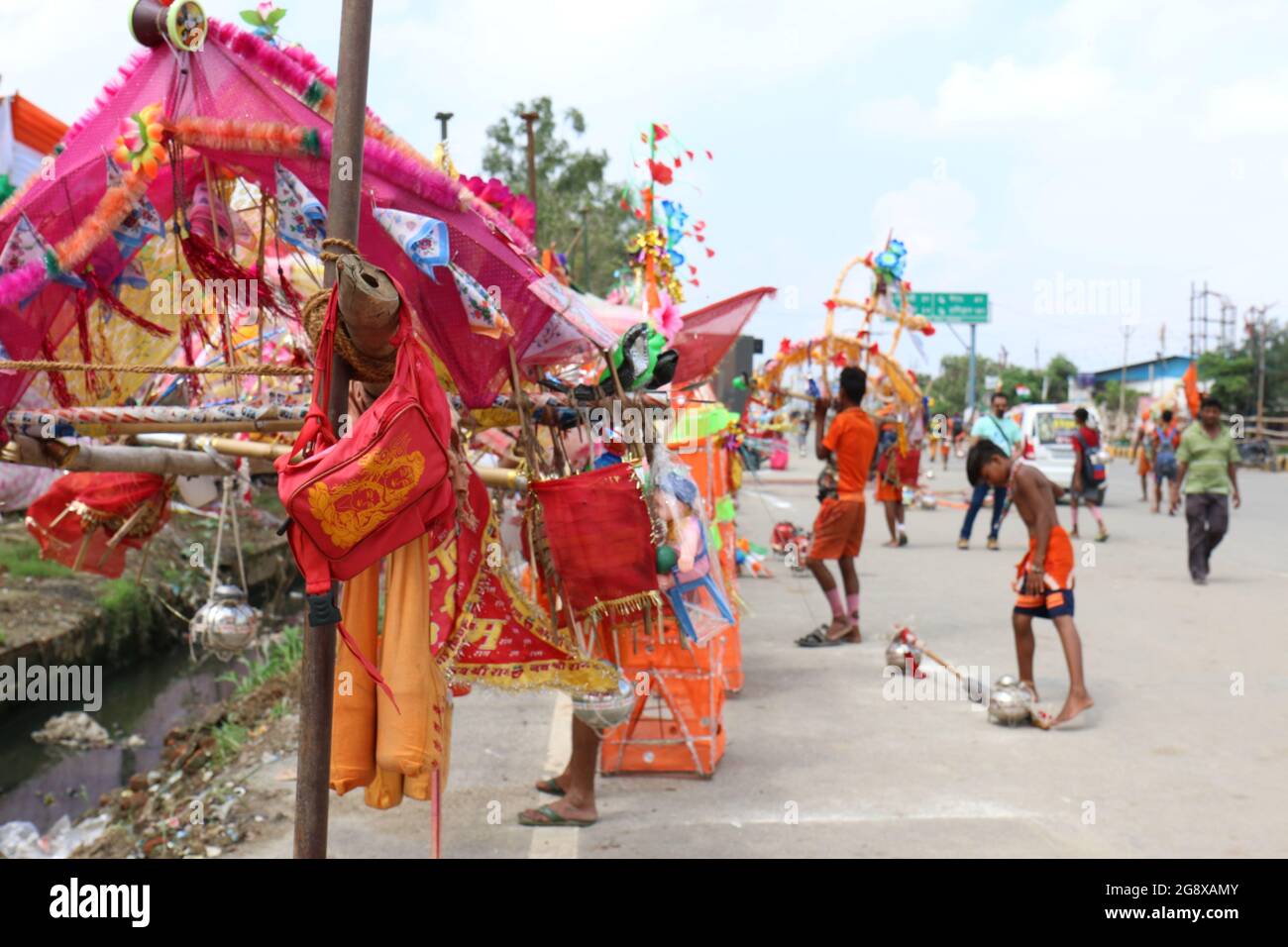 GHAZIABAD, INDIA - JULY 2019: A hindu devotee carrying kanwar on their ...