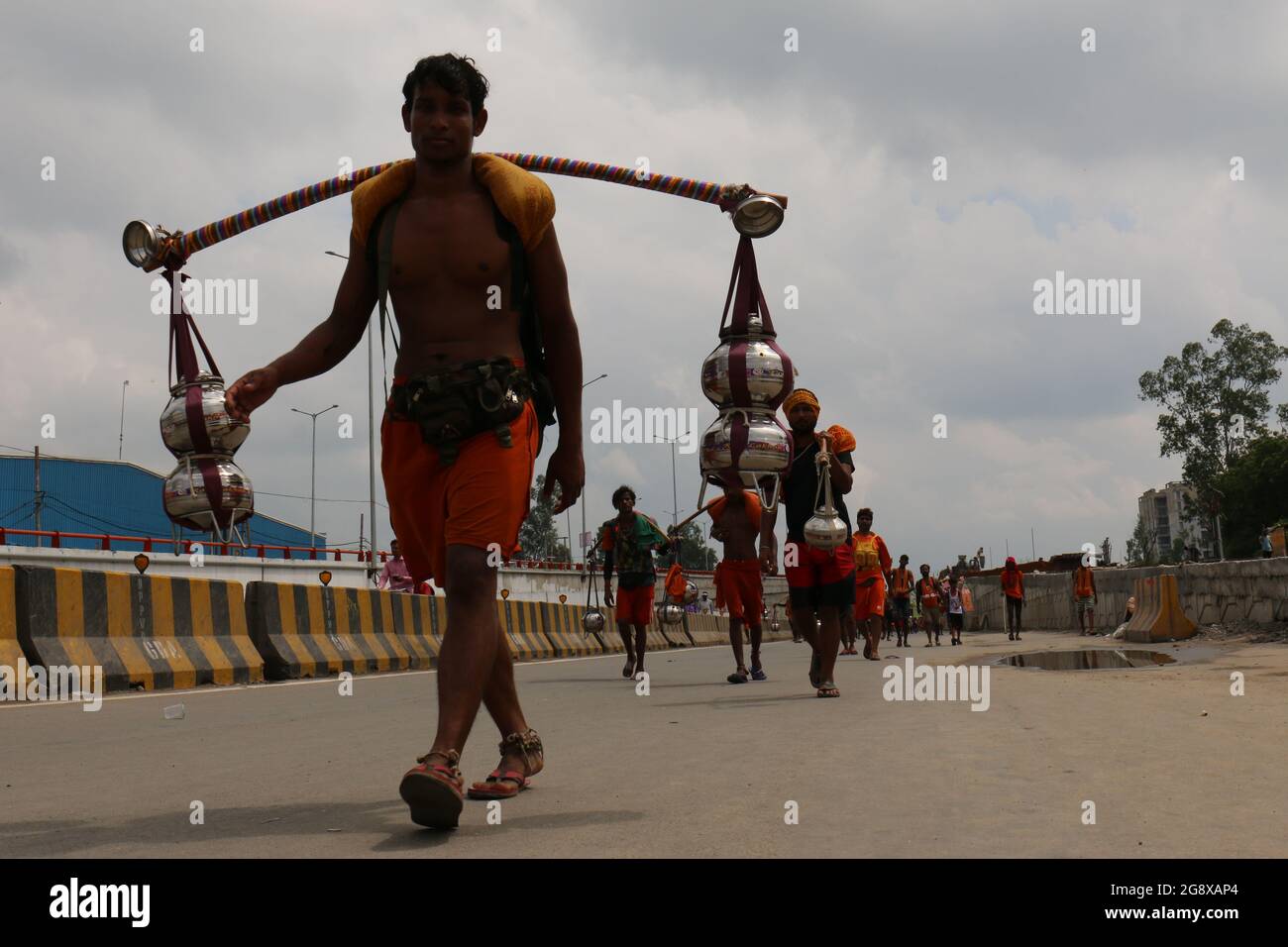 GHAZIABAD, INDIA - JULY 2019: A hindu devotee carrying kanwar on their ...