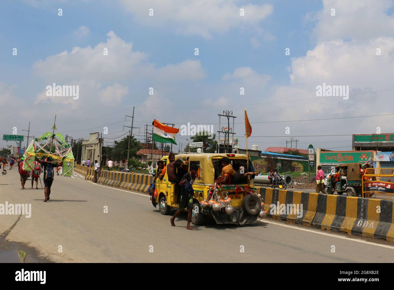 GHAZIABAD, INDIA - JULY 2019: A hindu devotee carrying kanwar on their ...