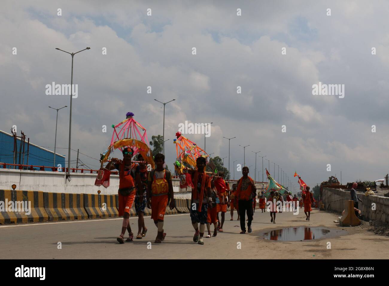 GHAZIABAD, INDIA - JULY 2019: A hindu devotee carrying kanwar on their ...