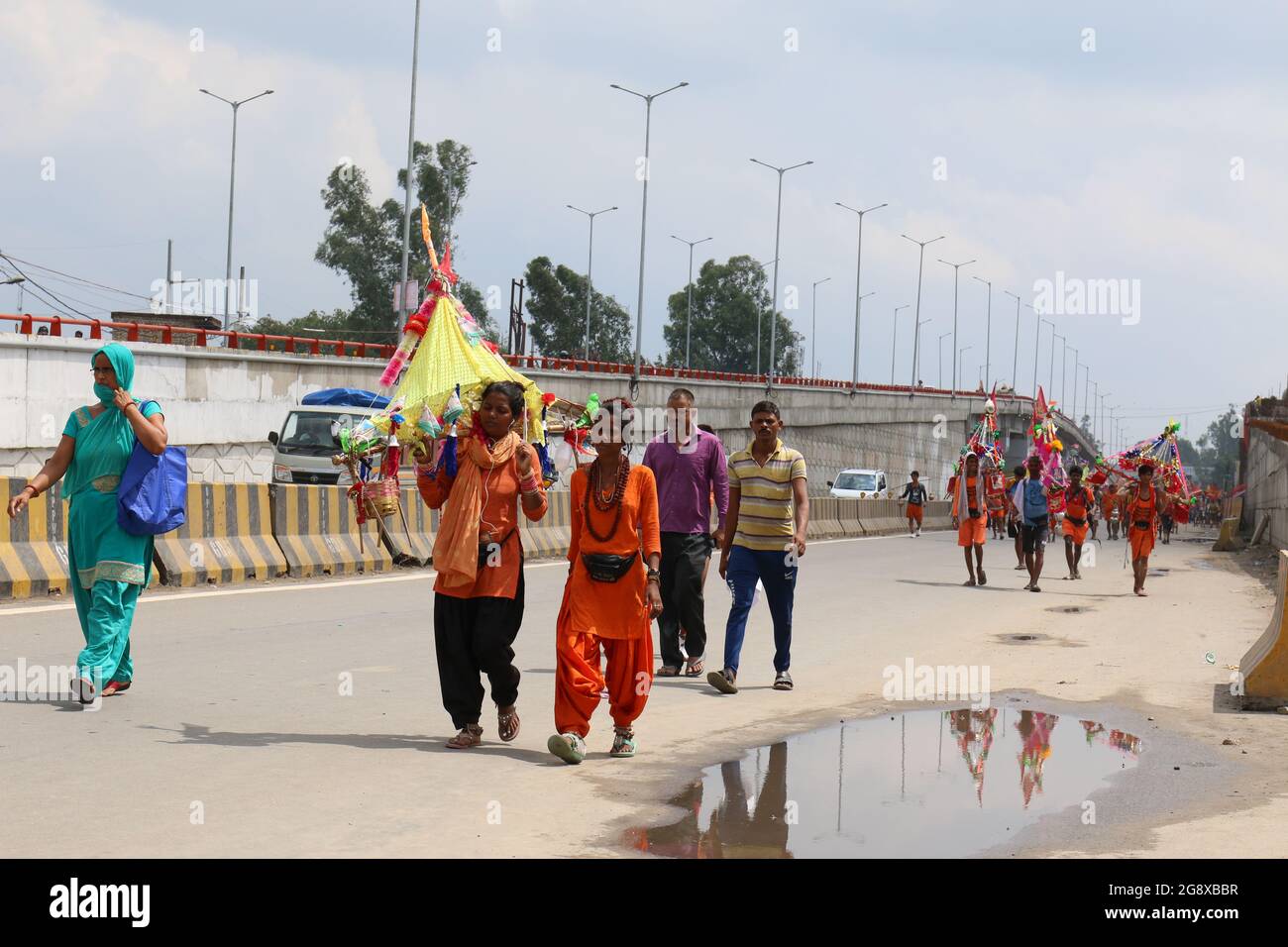 GHAZIABAD, INDIA - JULY 2019: A hindu devotee carrying kanwar on their ...