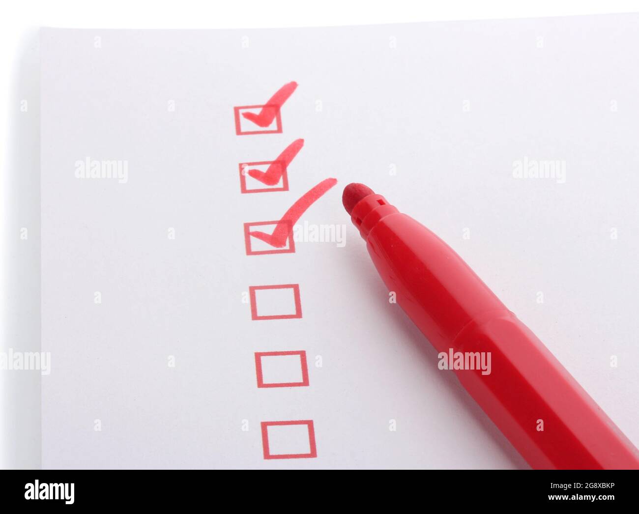 Checklist and red marker isolated on white Stock Photo - Alamy