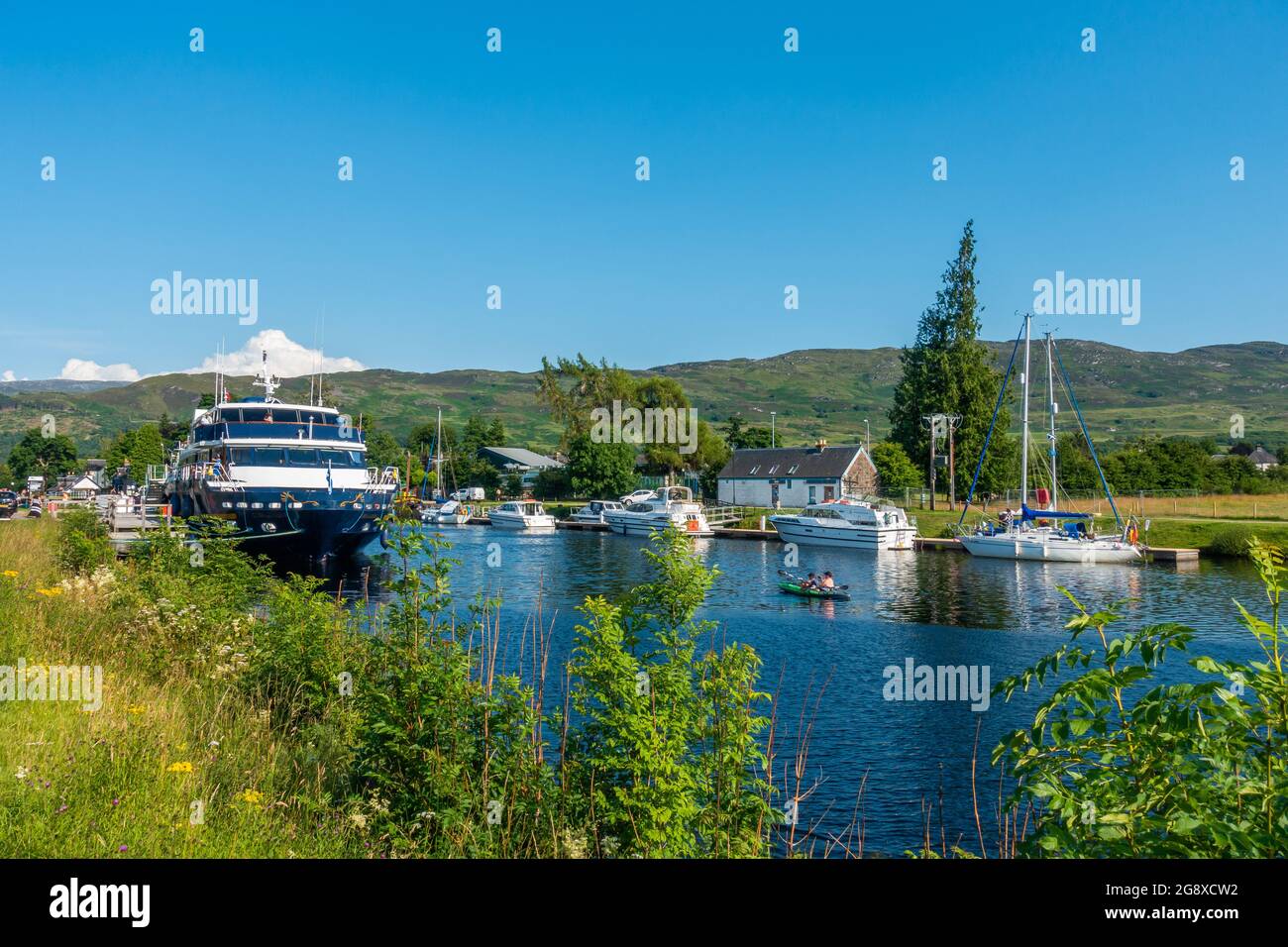 Boats on the Caledonian canal in the village of Fort Augustus, between ...