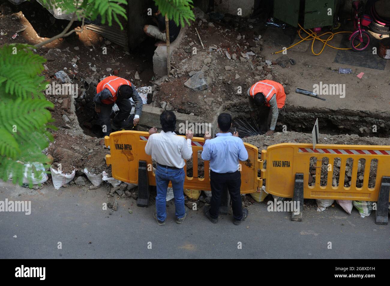 workers Pulling a fiber optic cable for fast internet and telephone ...