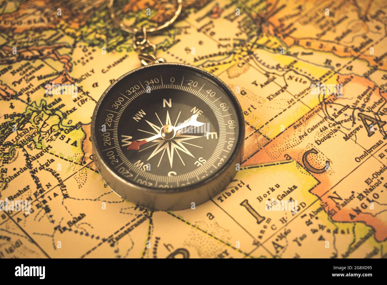 Compass on a tourist map, travel and journey concept background Stock ...