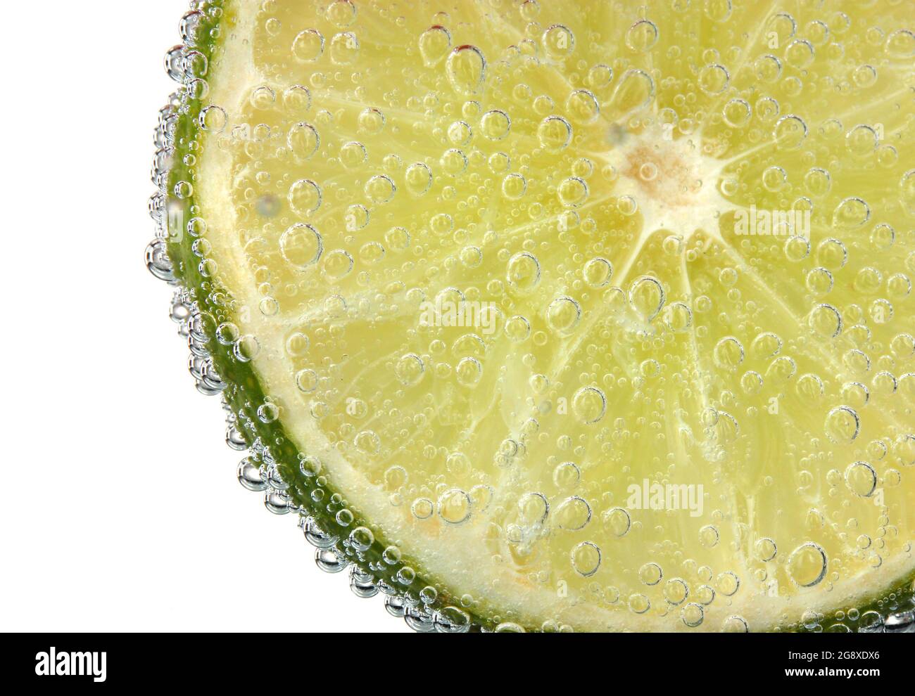 slice of lime in the water with bubbles Stock Photo - Alamy