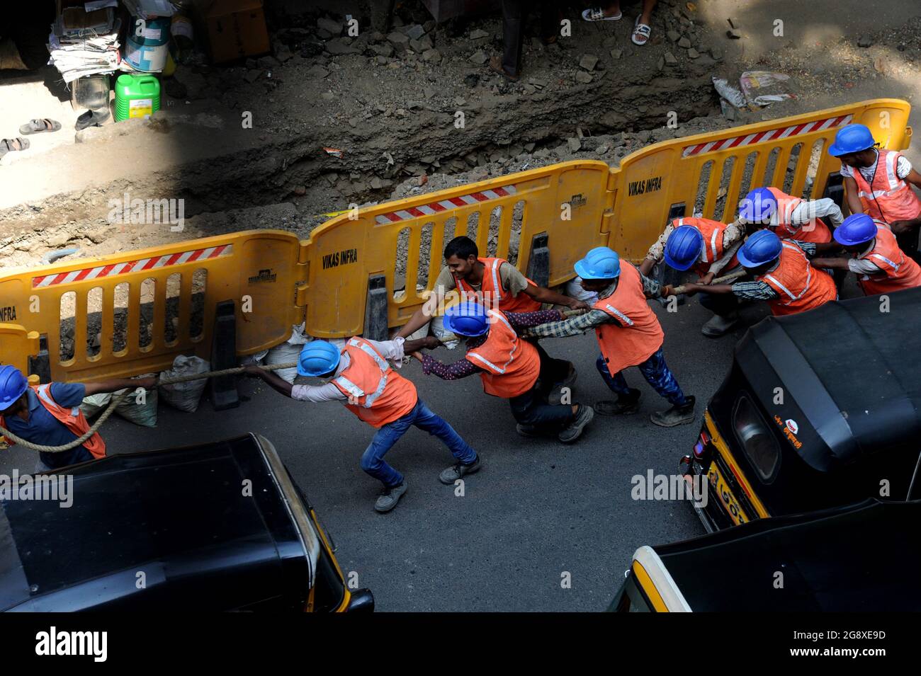 workers Pulling a fiber optic cable for fast internet and telephone ...