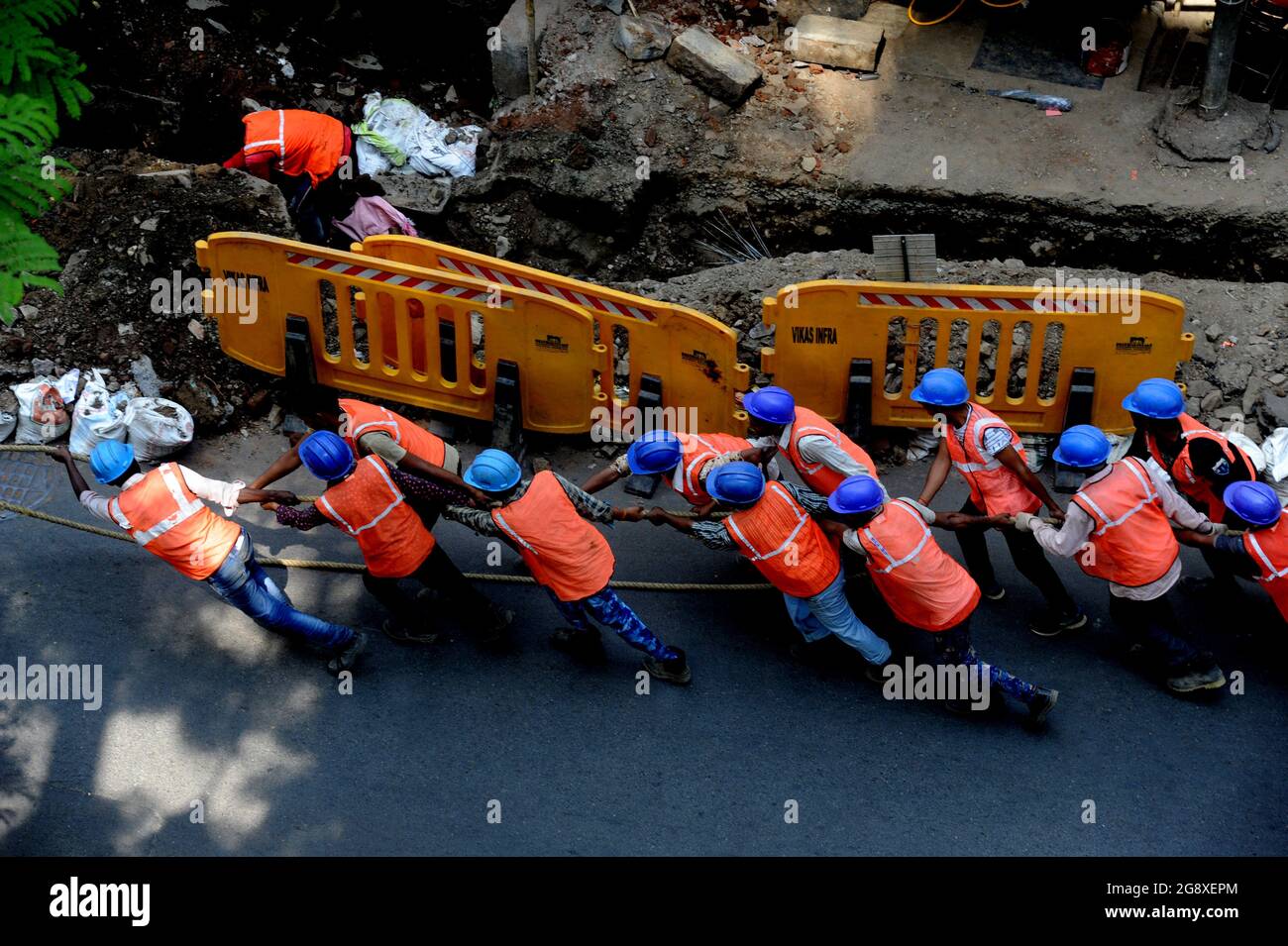 workers Pulling a fiber optic cable for fast internet and telephone ...