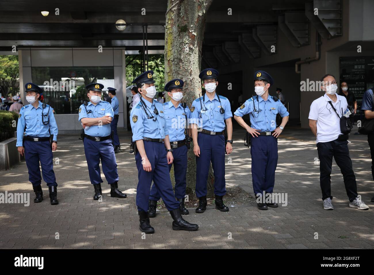 Tokyo, Japan. 23rd July, 2021. Police officers stand on guard during ...