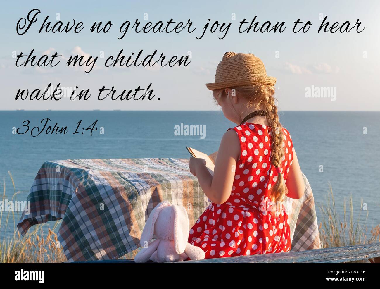 Little girl reading Bible on sea background. Quotes for believers ...