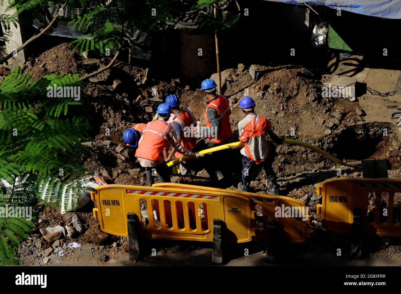 workers Pulling a fiber optic cable for fast internet and telephone ...