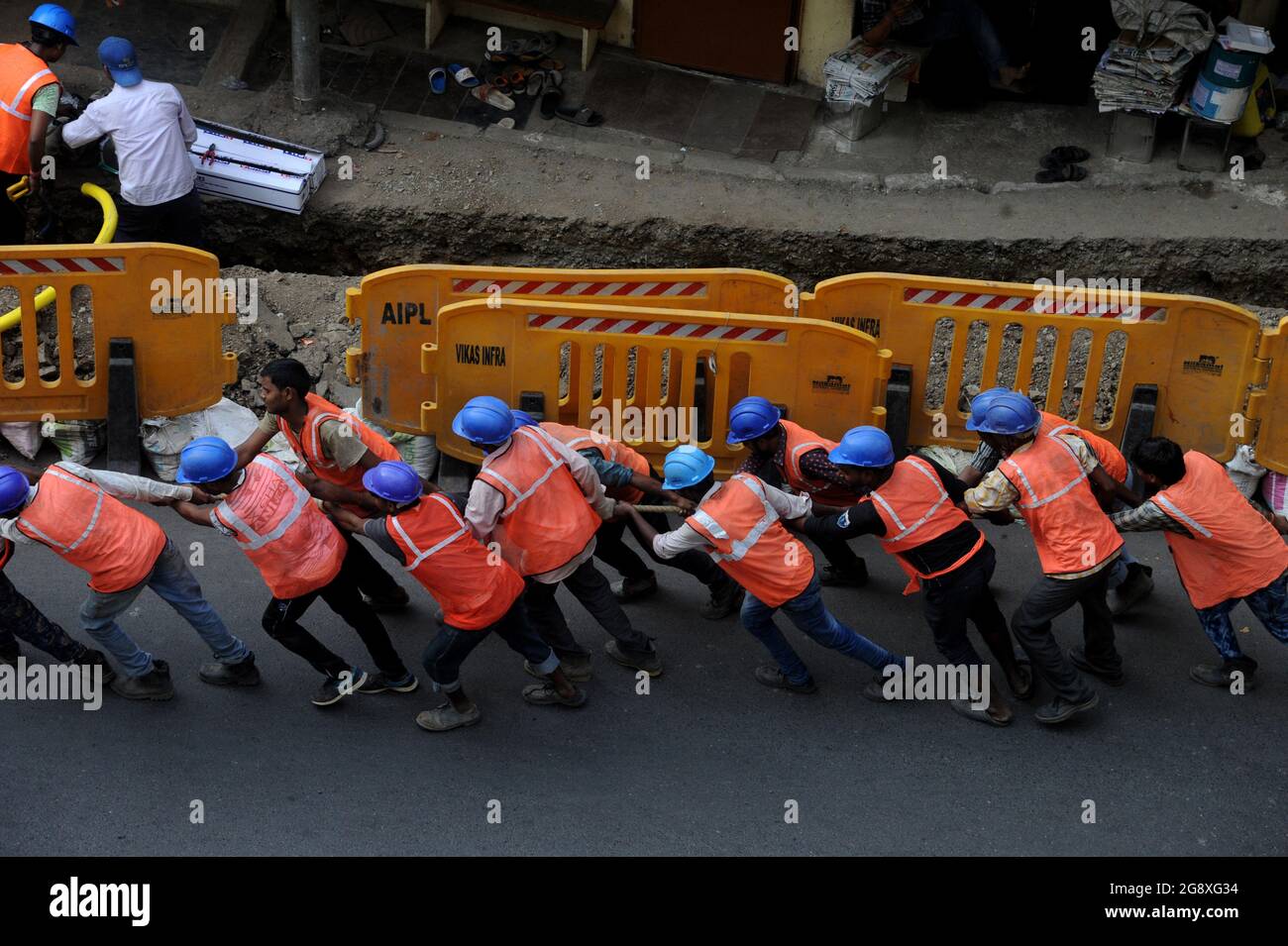 workers Pulling a fiber optic cable for fast internet and telephone ...