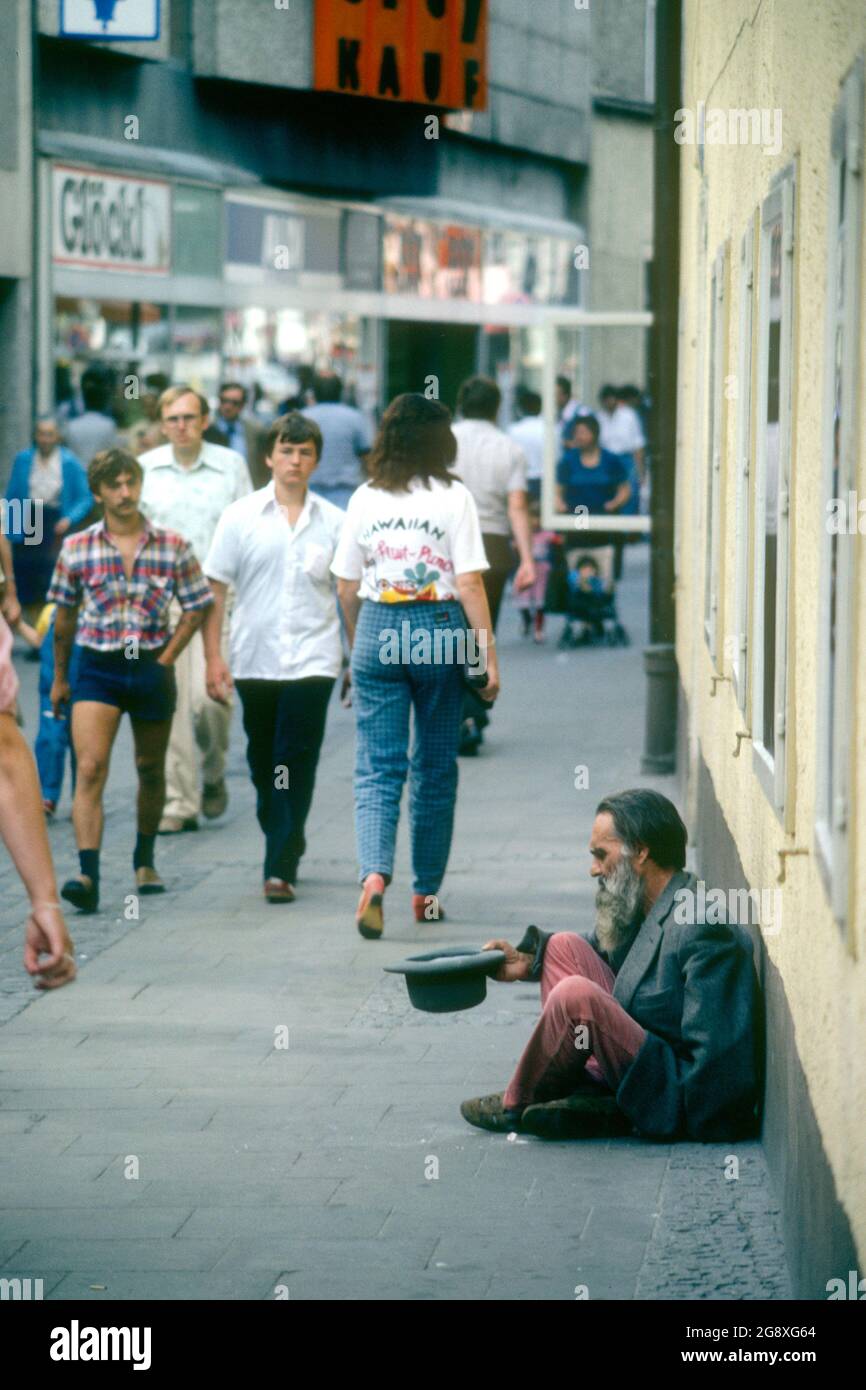 Homeless man begging in the street in 1981, Regensburg, Bavaria ...