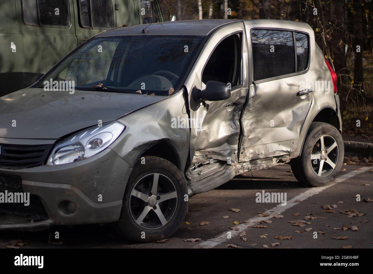Car after an accident. Broken transport. A battered car on the street ...