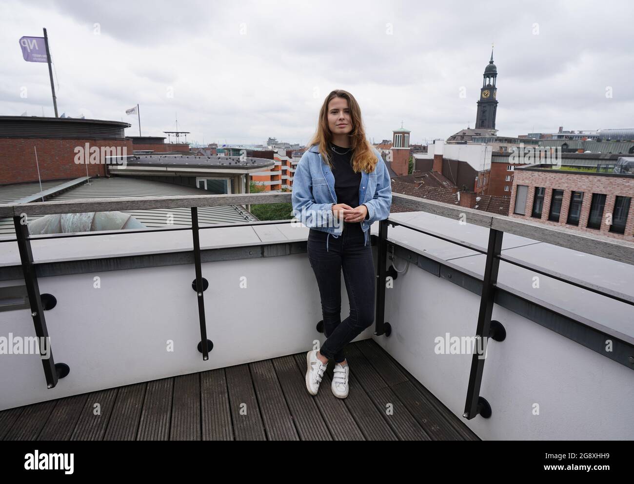 Hamburg, Germany. 23rd July, 2021. Climate activist Luisa Neubauer stands on a roof terrace ...