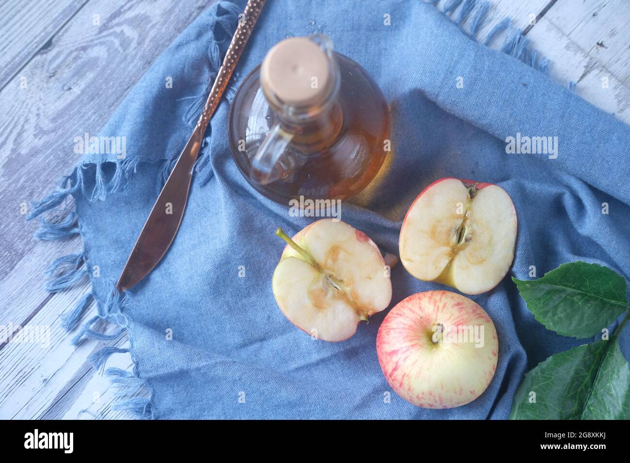 apple vinegar in glass bottle with fresh green apple on table Stock ...