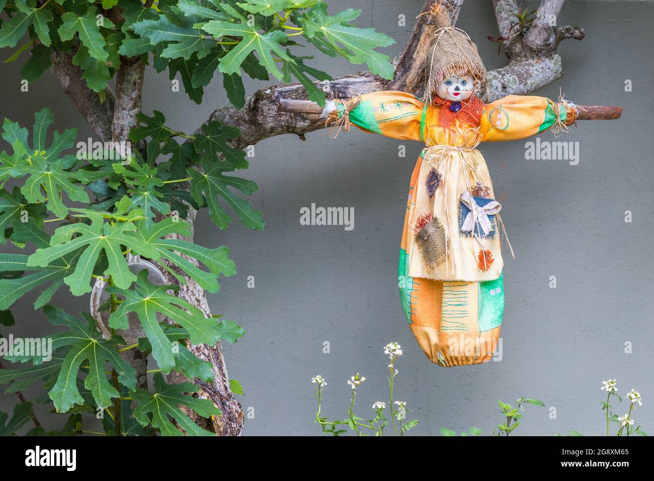 Bright decorated straw man Stock Photo - Alamy