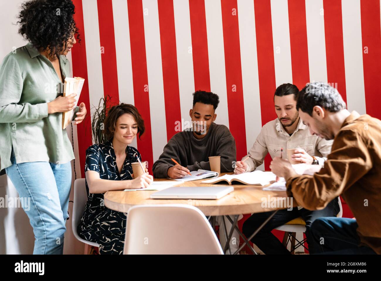 Mixed-race group shares ideas creative thoughts with multi-ethnic mates ...