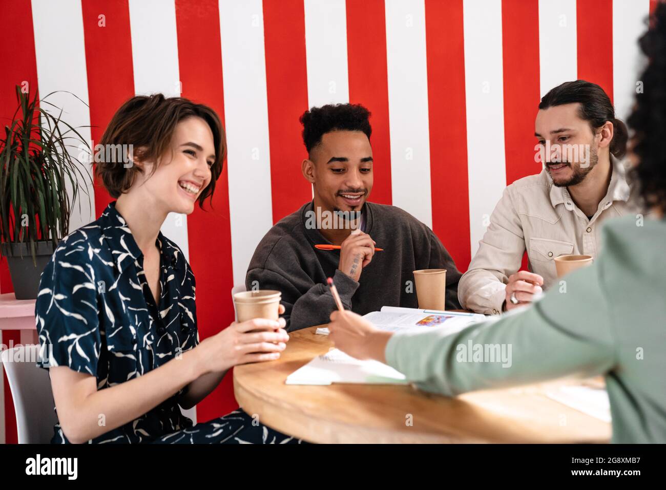 Mixed-race group shares ideas creative thoughts with multi-ethnic mates ...
