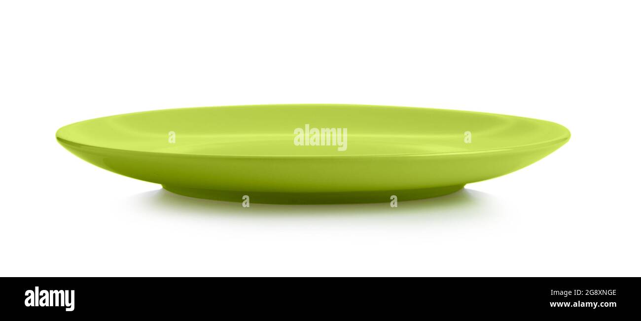 green ceramic plate on white background Stock Photo - Alamy