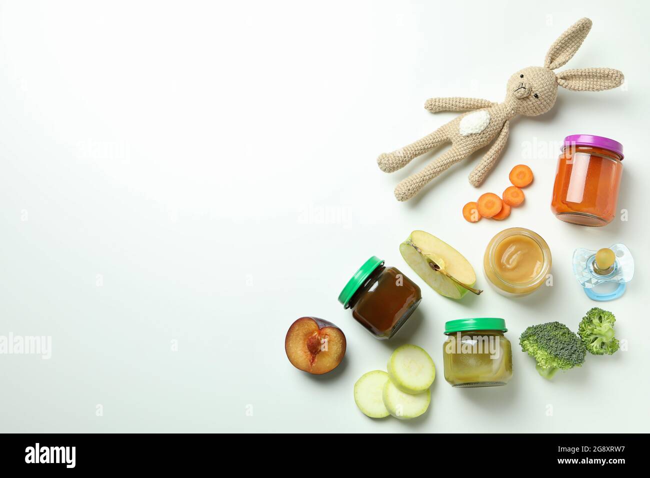 Concept of baby food on white background Stock Photo - Alamy
