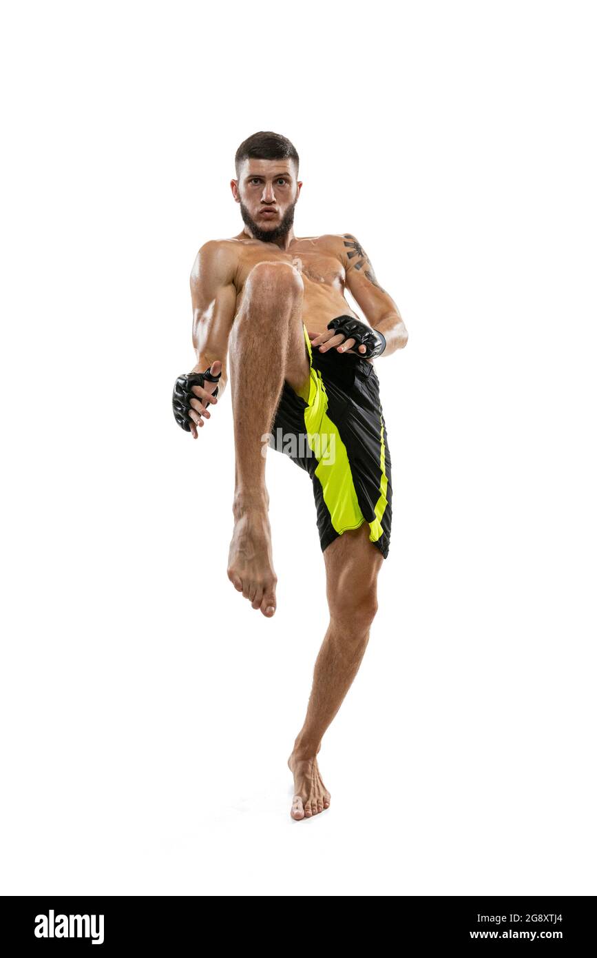 Professional male MMA boxer in action and motion isolated on white ...
