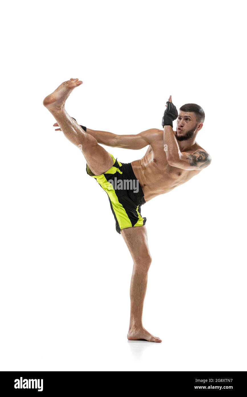 Professional male MMA boxer in motion isolated on white studio ...
