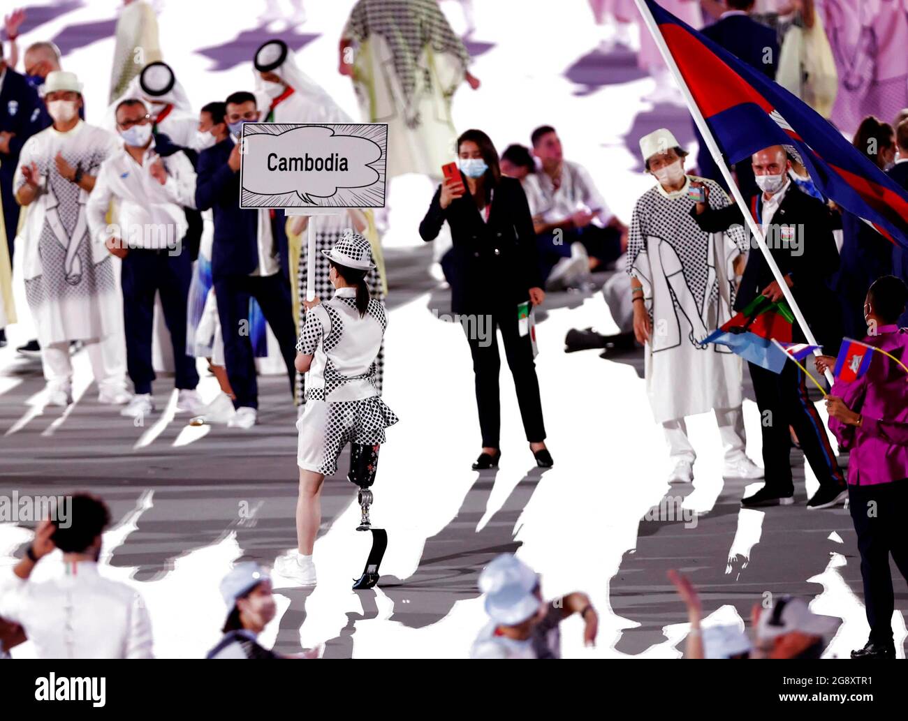 Tokyo, Japan. 23rd July, 2021. Placard bearer of Cambodia parades into ...