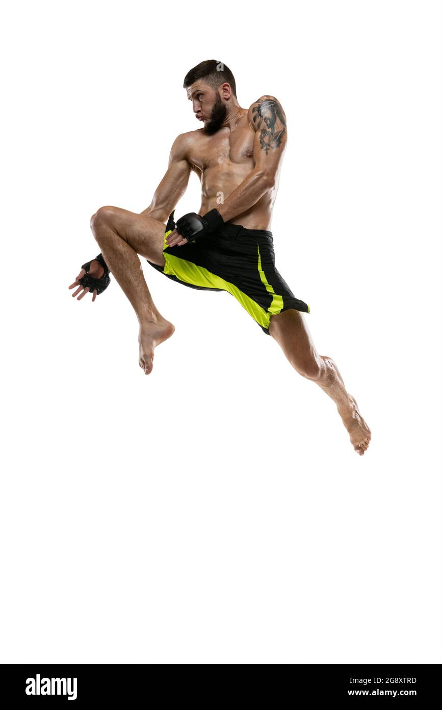 Professional male MMA boxer in motion isolated on white studio ...