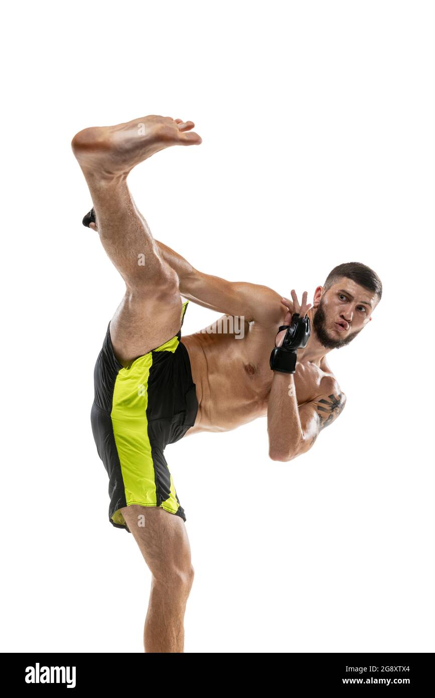 Professional male MMA boxer in motion isolated on white studio ...