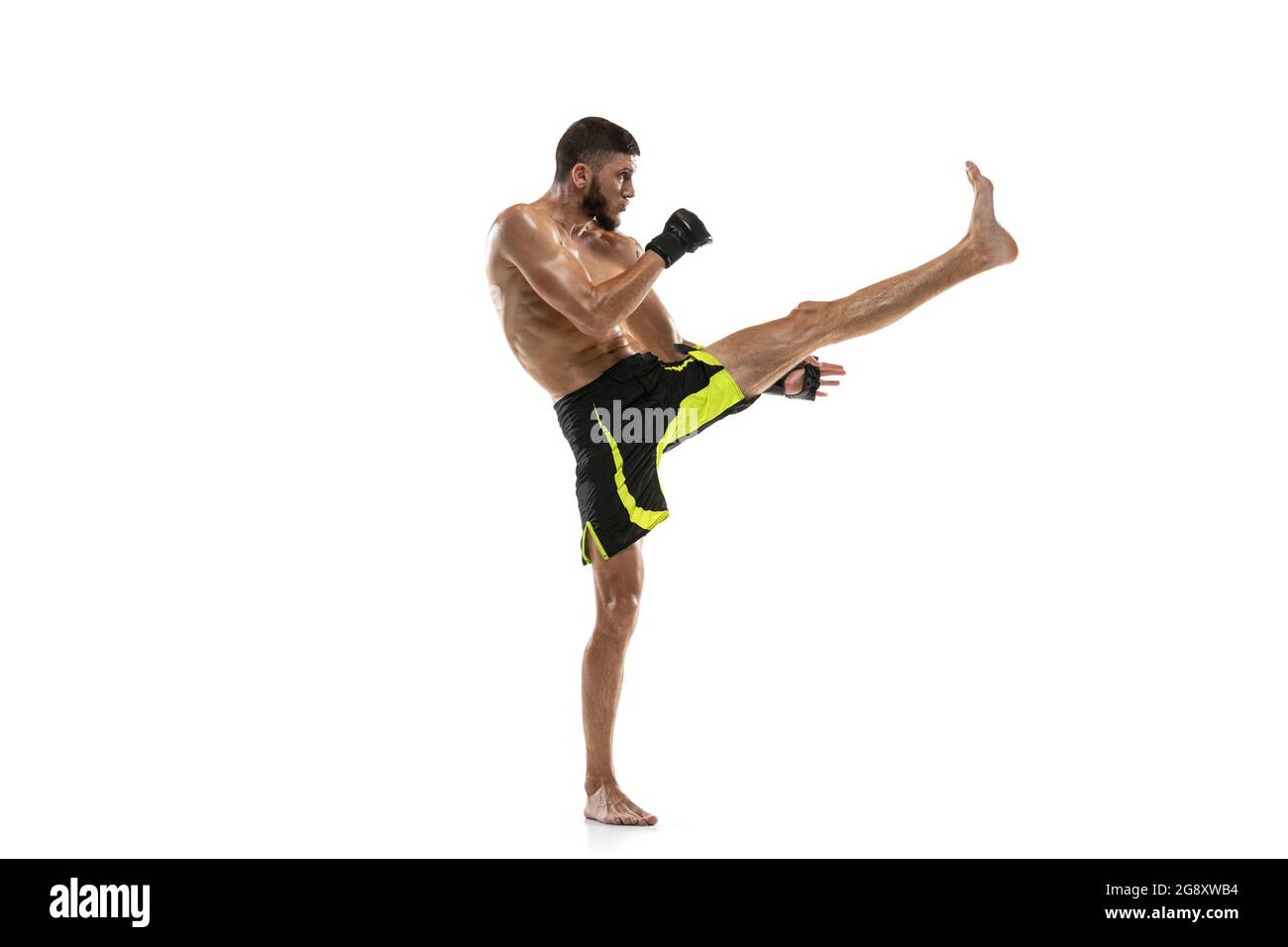 Professional male MMA boxer in motion isolated on white studio ...
