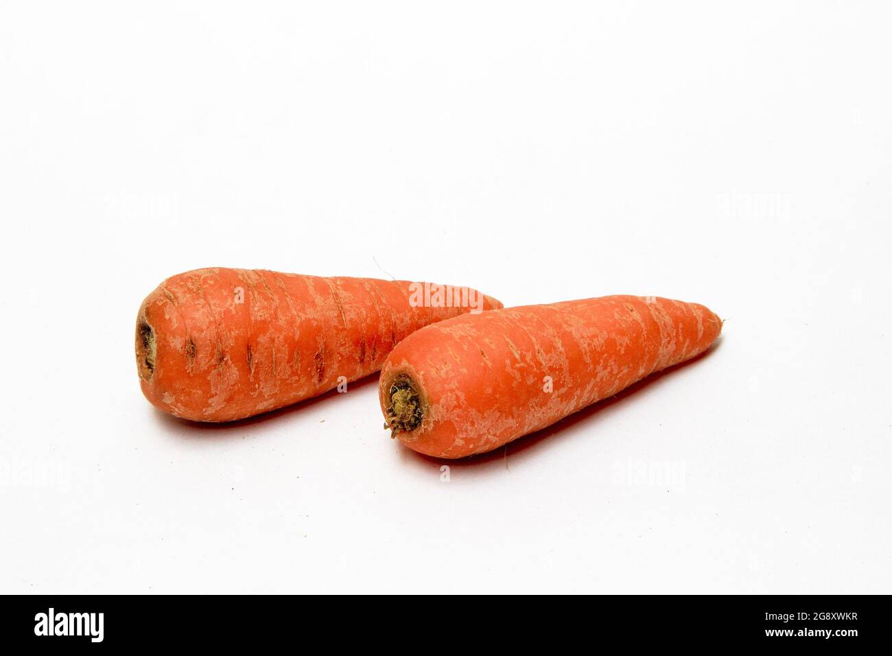 Two carrots, which are a rich sources of beta-carotene and fiber ...