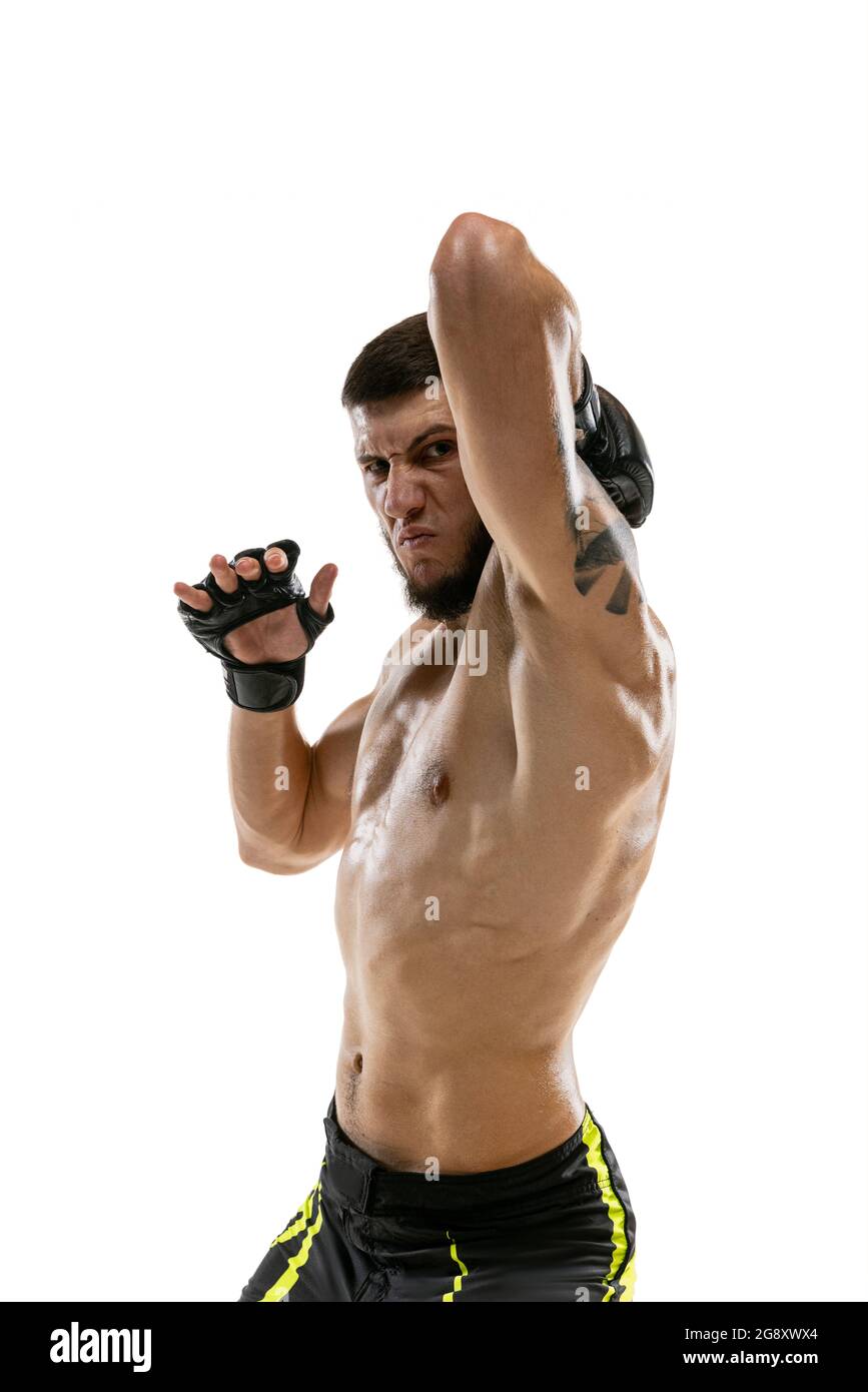 One man, professional male MMA boxer in motion isolated on white studio ...