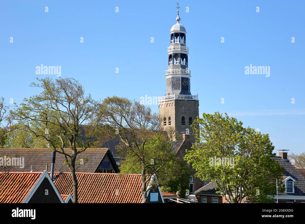 Close-up on the clock tower of the historical town of Hindeloopen ...