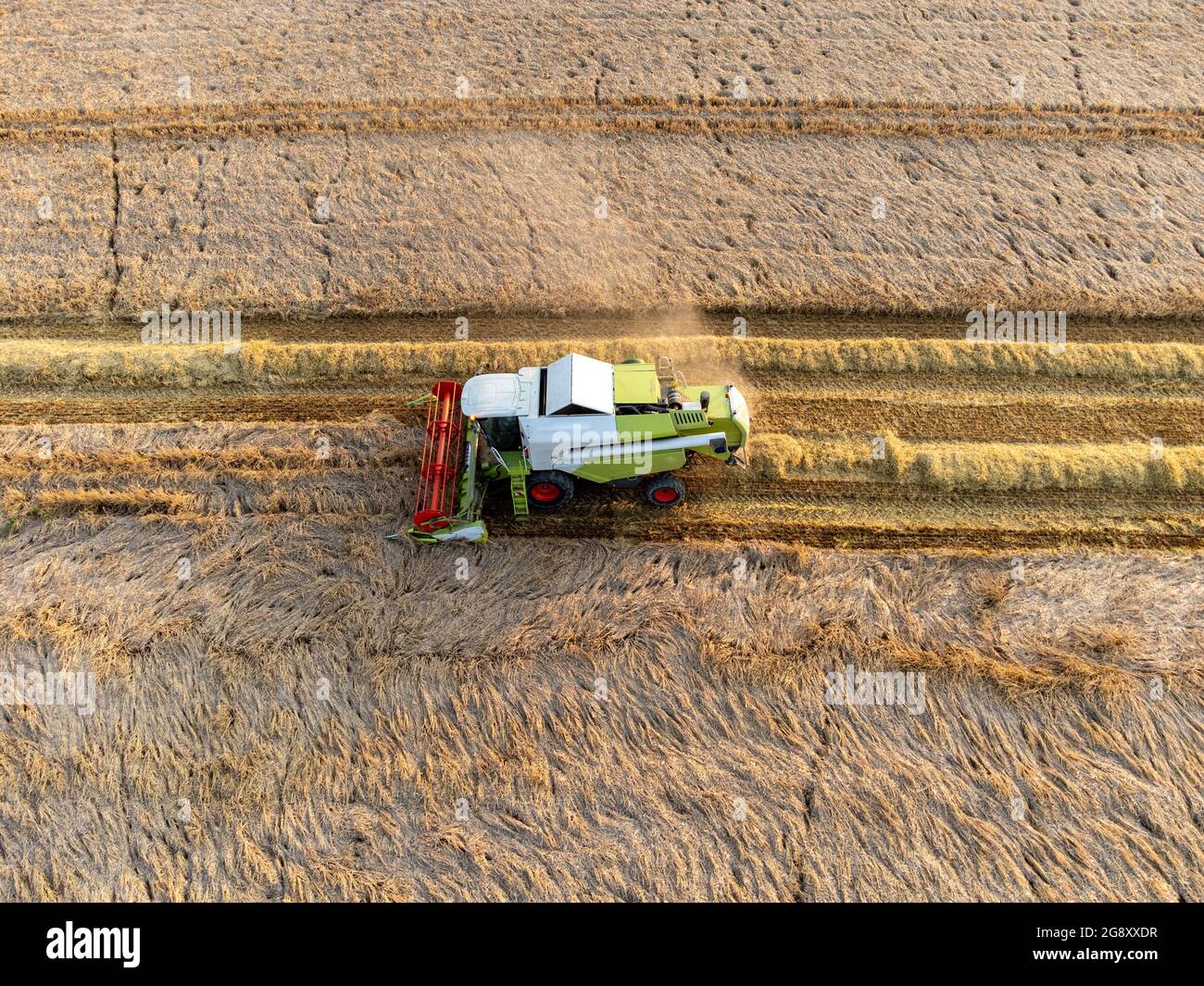 Aerial view of a combine harvester during the harvest Stock Photo - Alamy