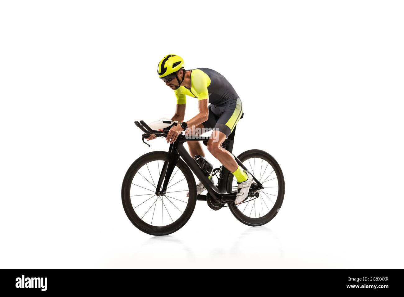 Side view. One professional male cyclist on road bike turning to the ...