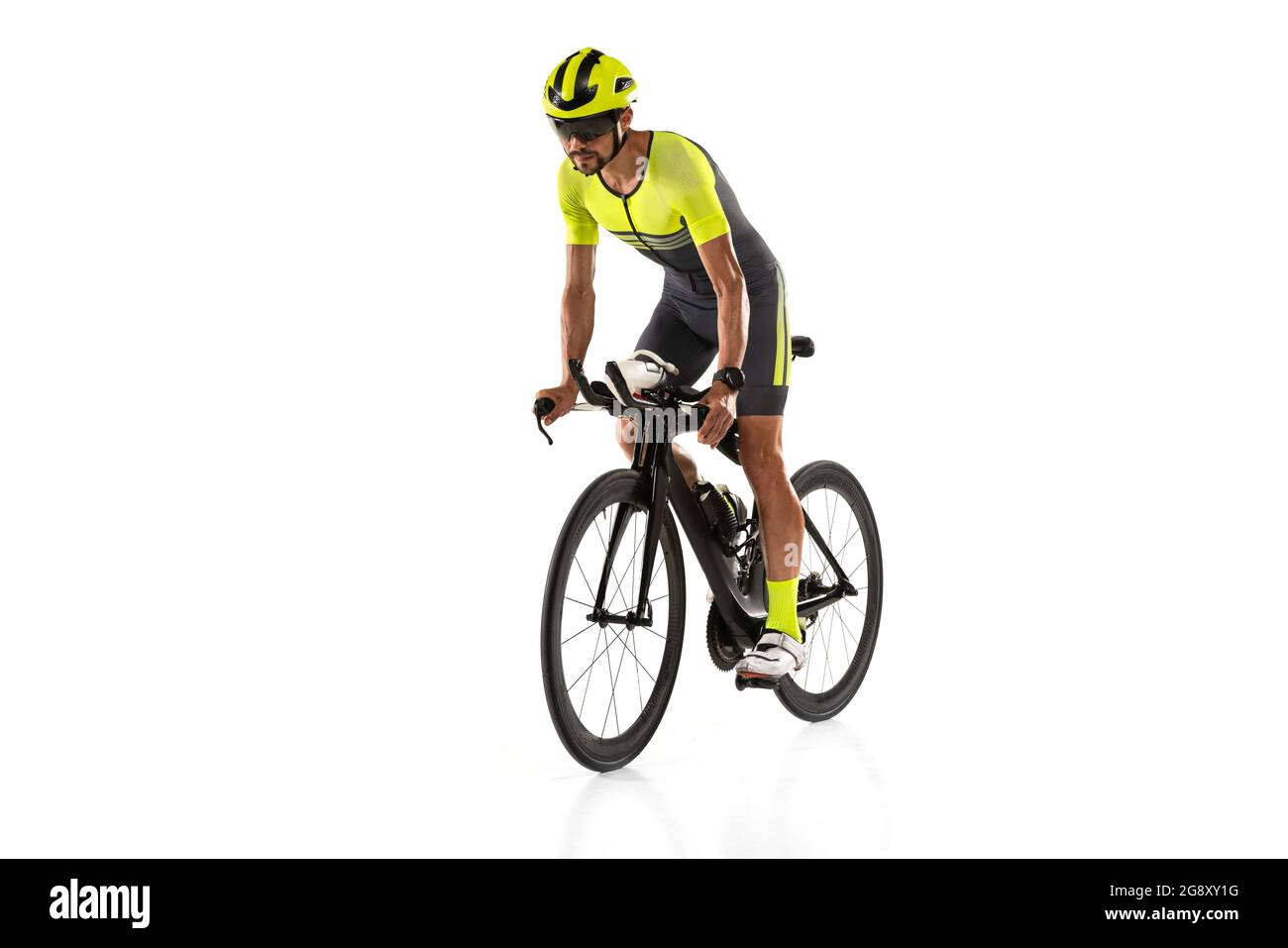 Studio shot of one young professional bicyclist, man on road bike ...