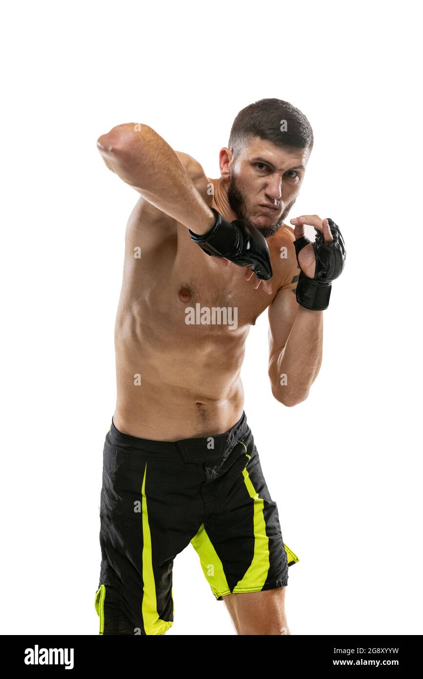 Close-up professional male MMA boxer in motion isolated on white studio ...
