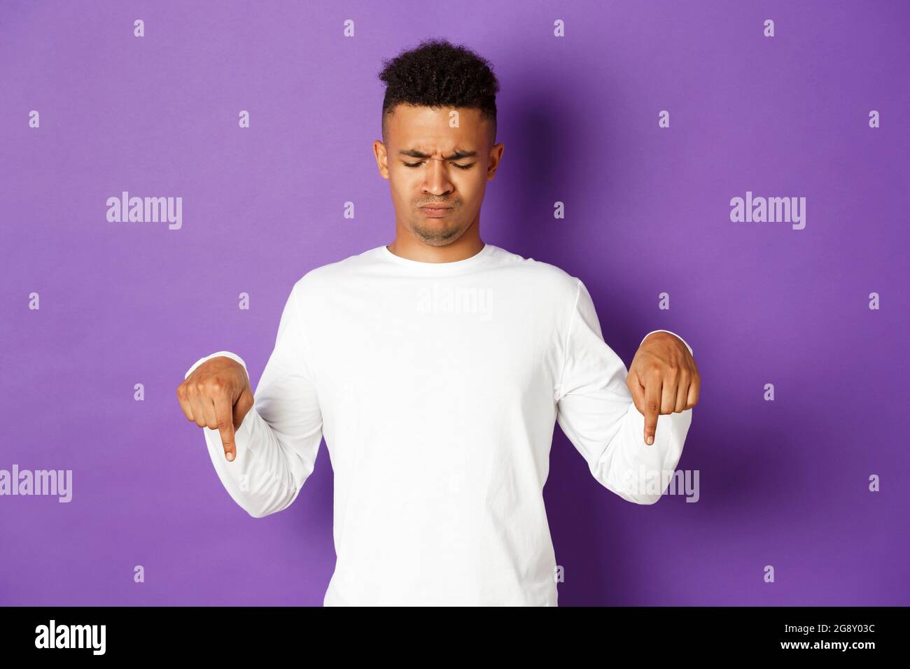 Portrait of skeptical and disappointed african-american male model in ...